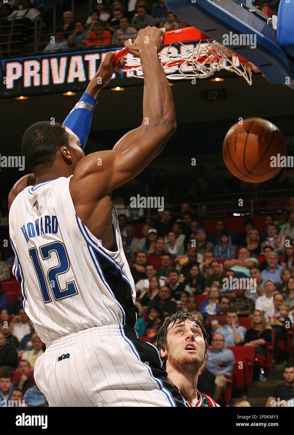 Orlando Magic center Dwight Howard slam dunks over Milwaukee Bucks ...