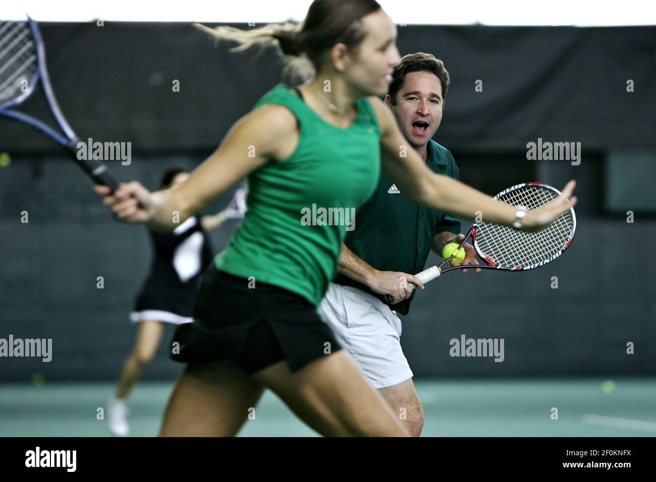 Tennis Pro Tim Barnes, right, leads an instructional lesson, January 15 ...