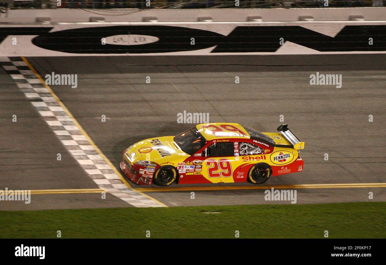 Kevin Harvick crosses the finish line to win the Bud Shootout at the ...