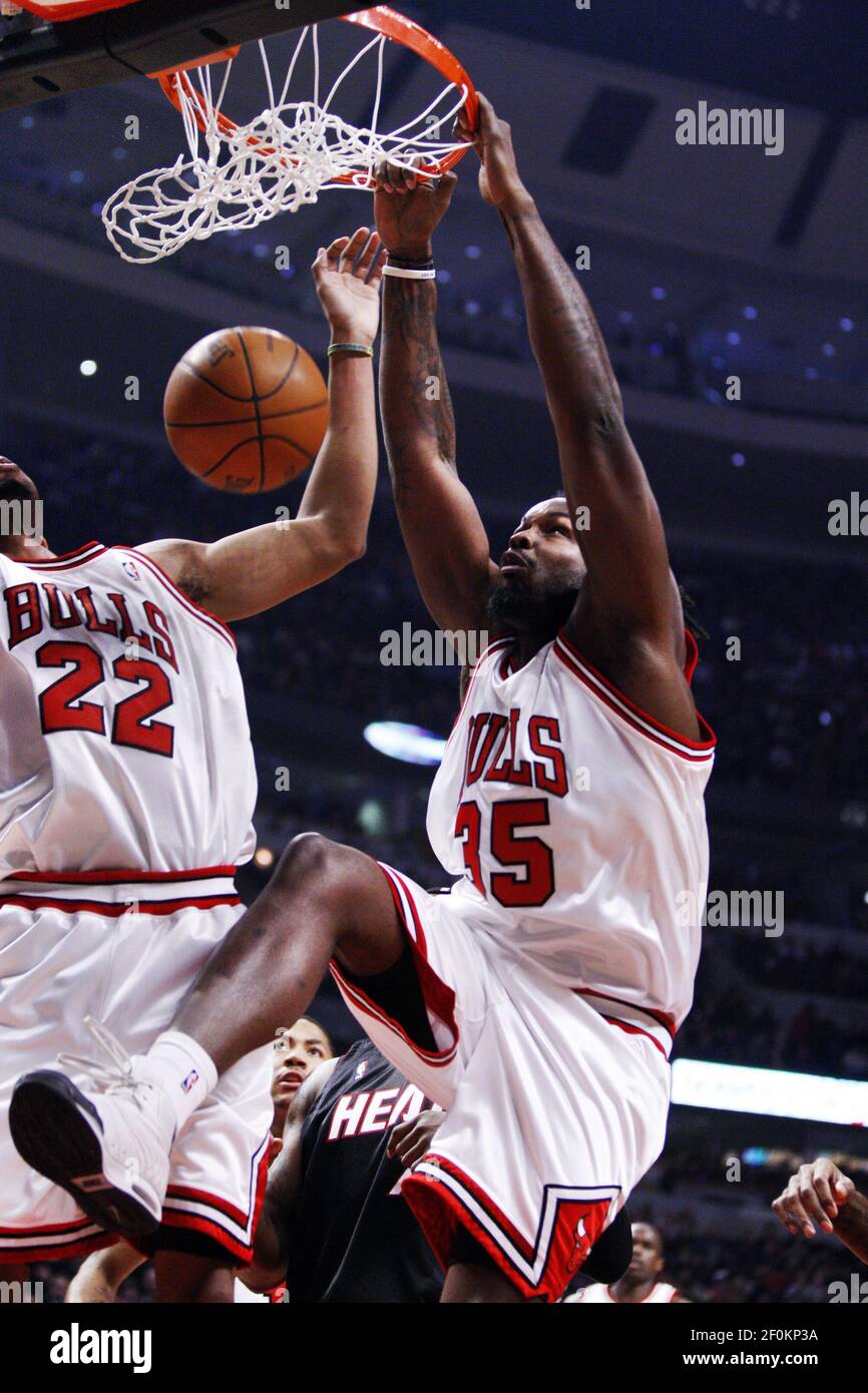Chicago Bulls player Chris Richard dunks against the Miami Heat in the ...