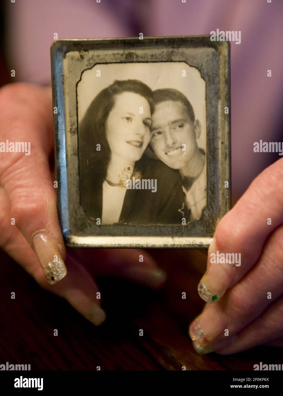 Barbara Metzinger holds a photo of her and her husband, Ernest, from ...
