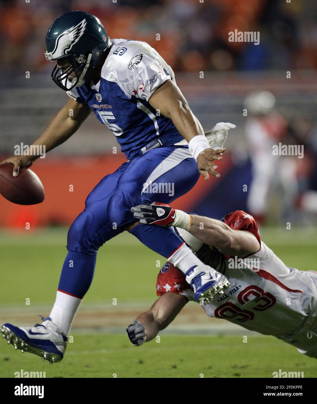 NFC quarterback Donovan McNabb (5) eludes AFC defensive end Kyle Vanden ...
