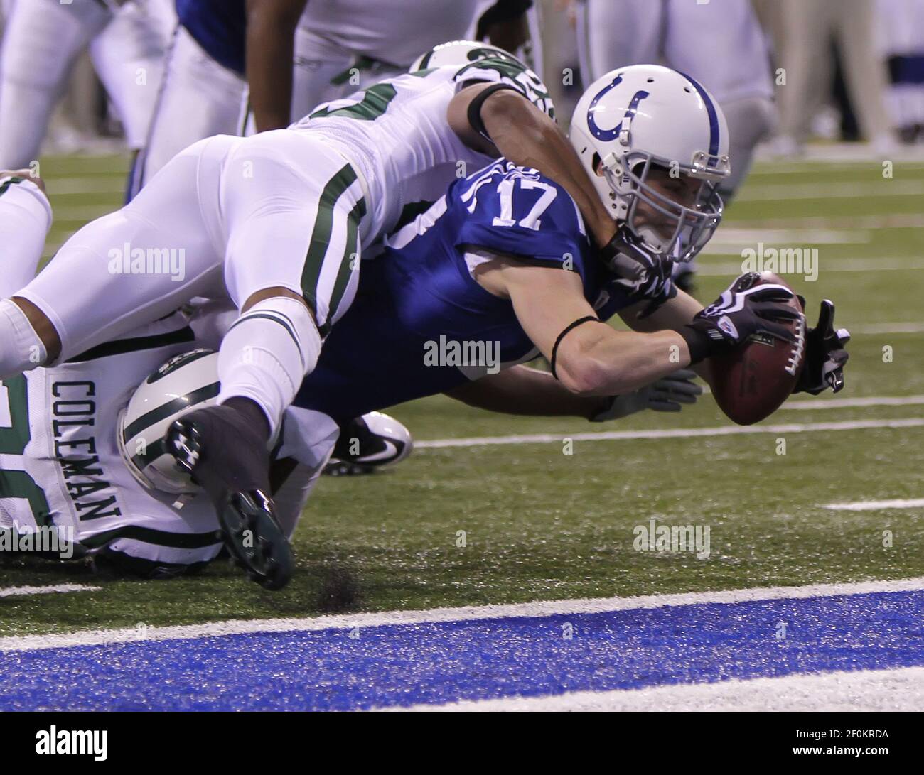Austin Collie of the Indianapolis Colts (17) is stopped short of the ...