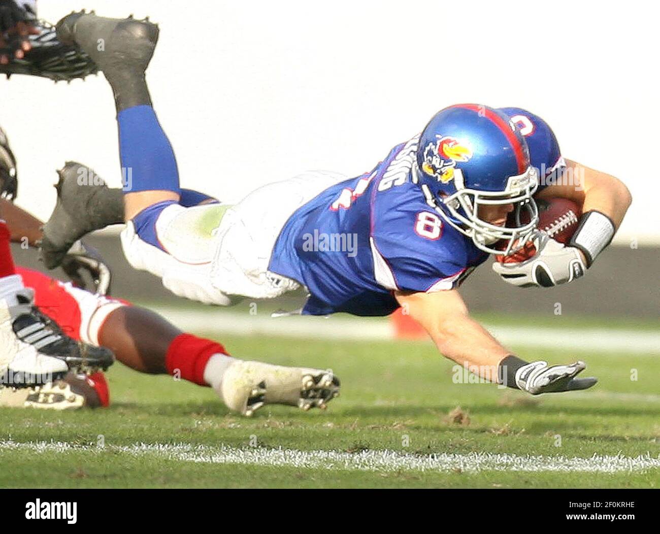 West quarterback Todd Reesing leaps for extra yardage during the East ...