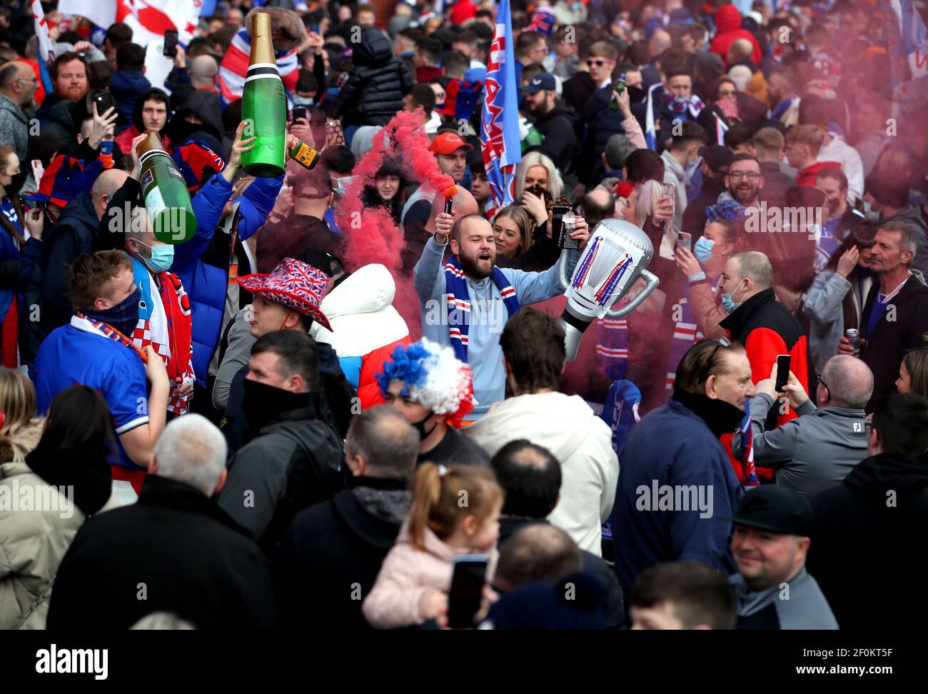 Rangers fans celebrate outside of the Ibrox Stadium after Rangers win ...