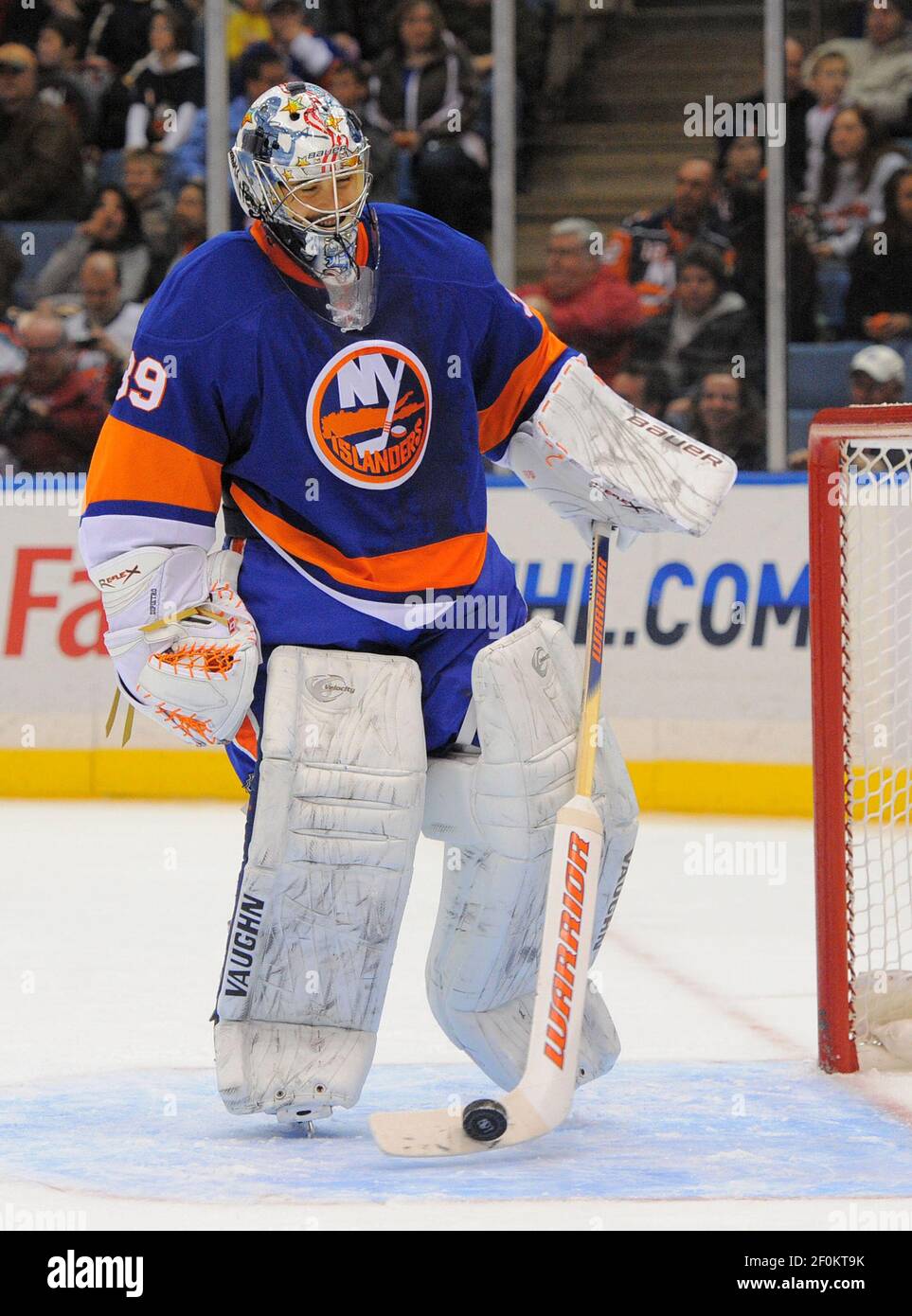 New York Islanders goalie Rick DiPietro (39) toys with the puck after ...