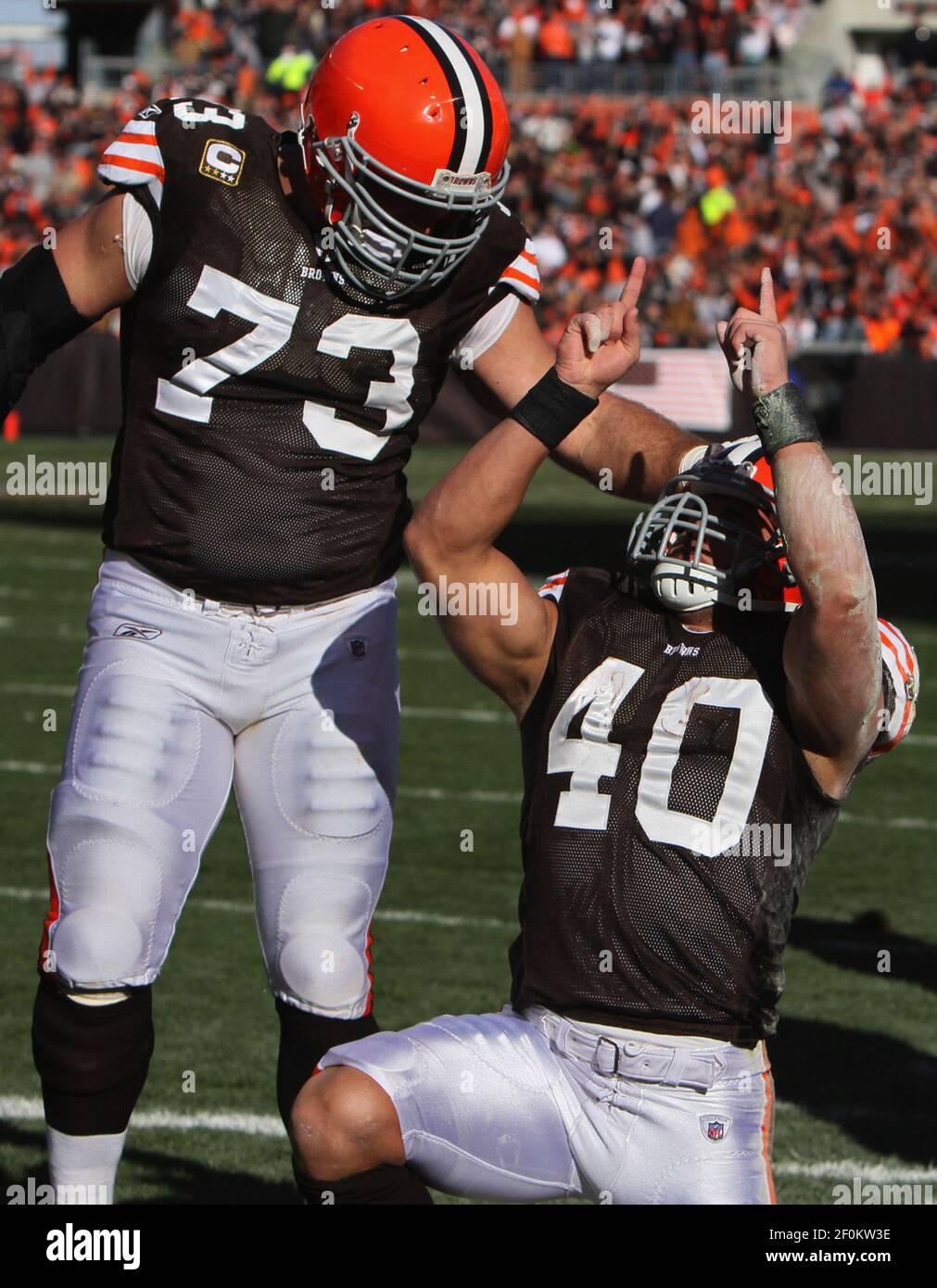 Cleveland running back Peyton Hillis, right, celebrates with teammate ...