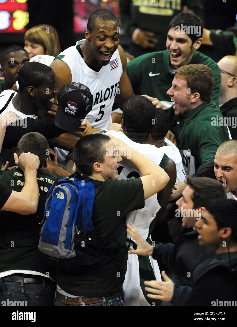 Members of the Charlotte 49ers celebrate with fans after defeating the ...