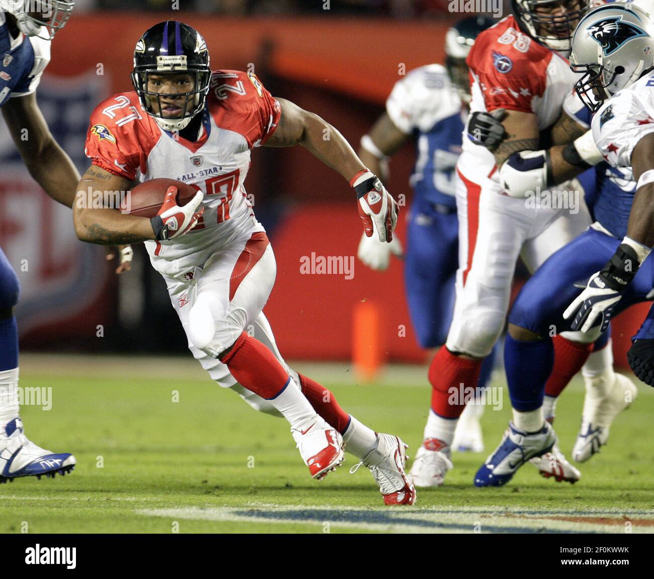 AFC running back Ray Rice (27) tears away from the crowd in the second ...