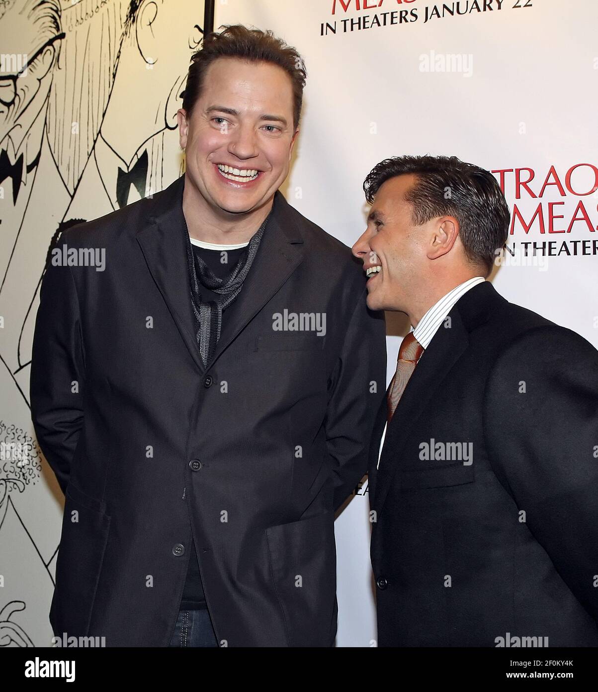 During a red carpet event, actor Brendan Fraser, left, shares a laugh ...