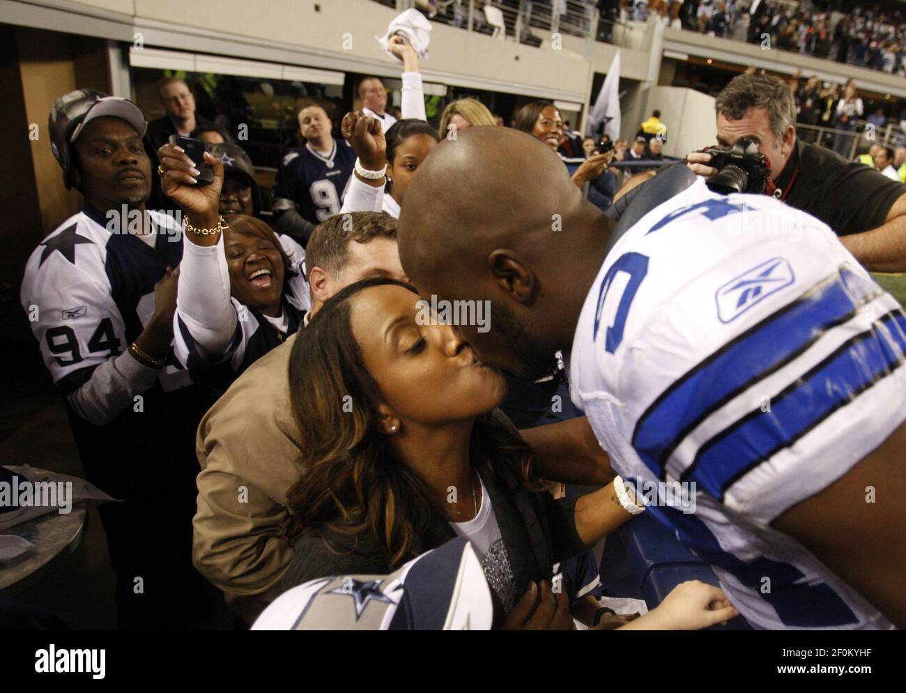 The Dallas Cowboys' DeMarcus Ware kisses his wife, Taniqua Ware, after ...