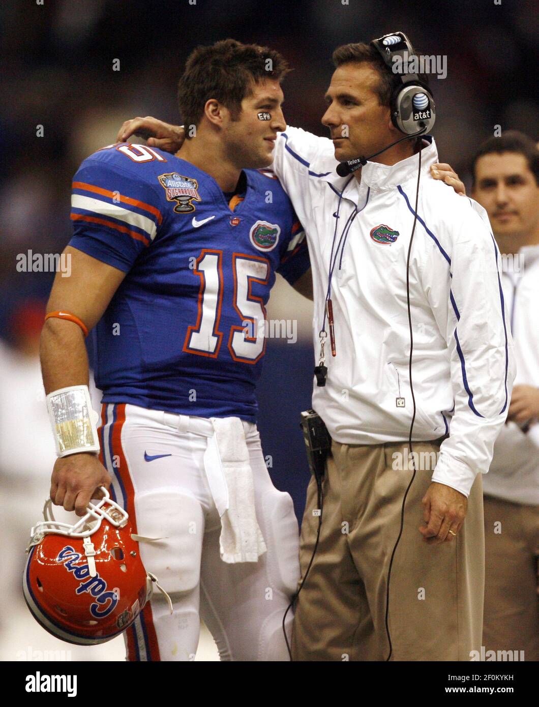 Florida coach Urban Meyer and quarterback Tim Tebow share a moment on ...