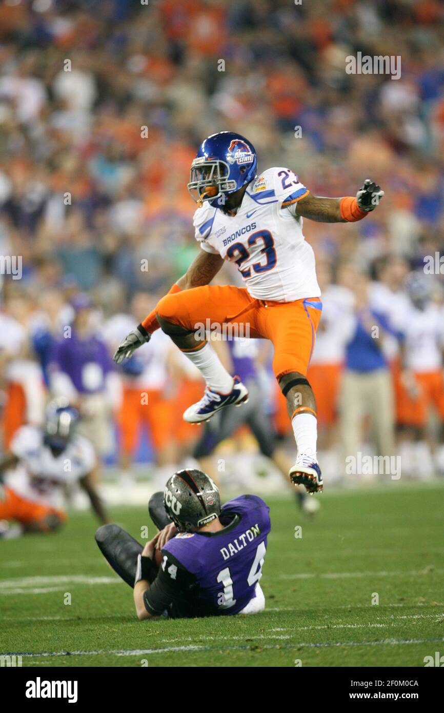 Boise State safety Jeron Johnson leaps over Texas Christian quarterback ...