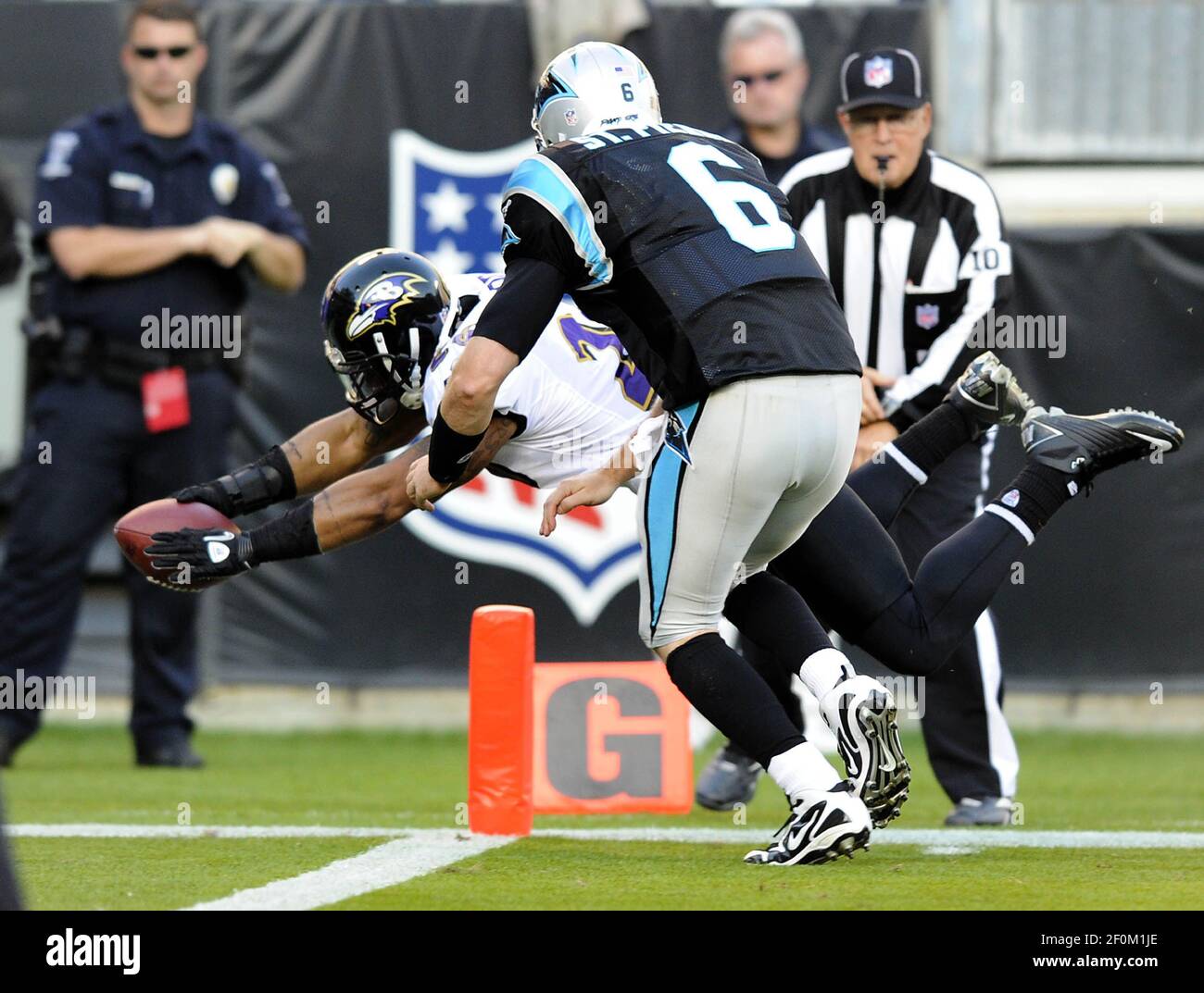 Carolina Panthers' Brian St. Pierre (6) tries to stop Baltimore Ravens ...