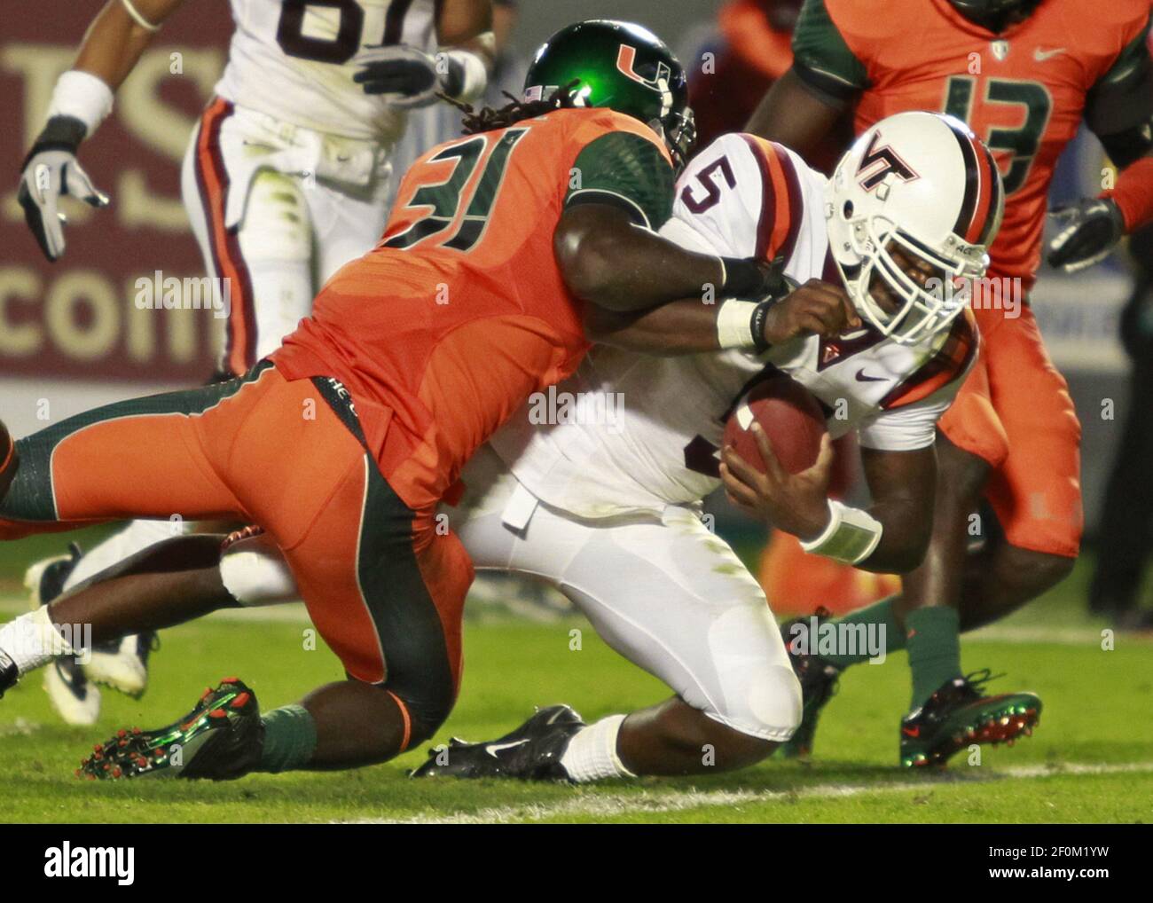 Virginia Tech quarterback Tyrod Taylor (5) scores in the fourth quarter ...