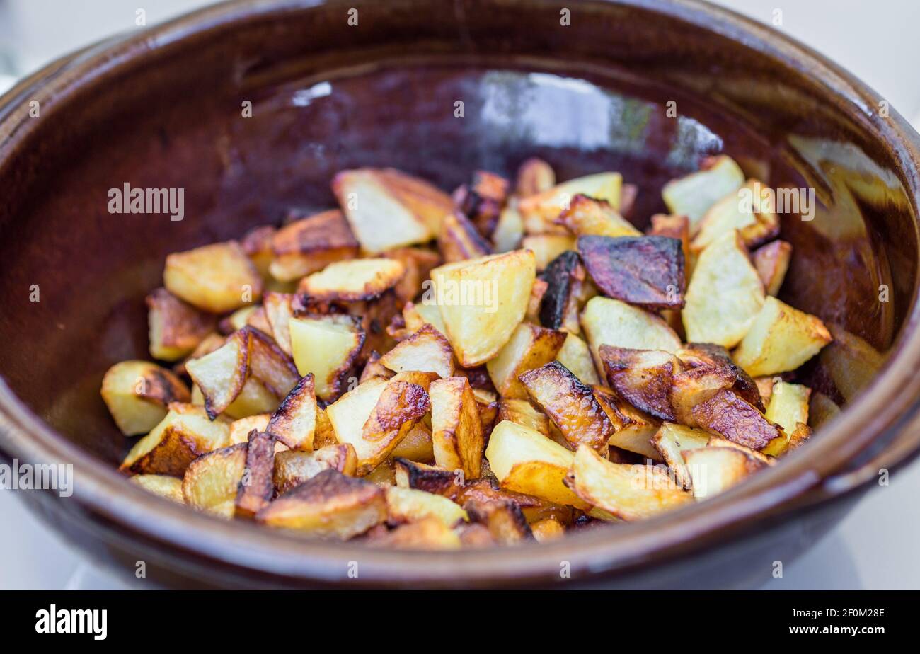 Roasted potato in bowl Stock Photo - Alamy