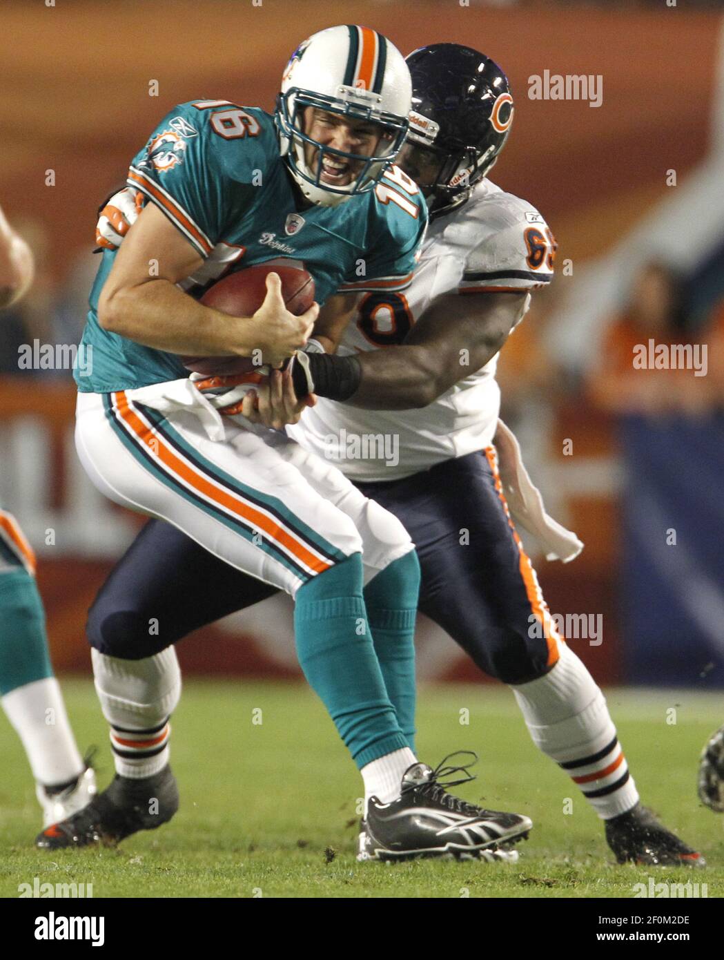 Miami Dolphins quarterback Tyler Thigpen (16) is sacked in the second ...