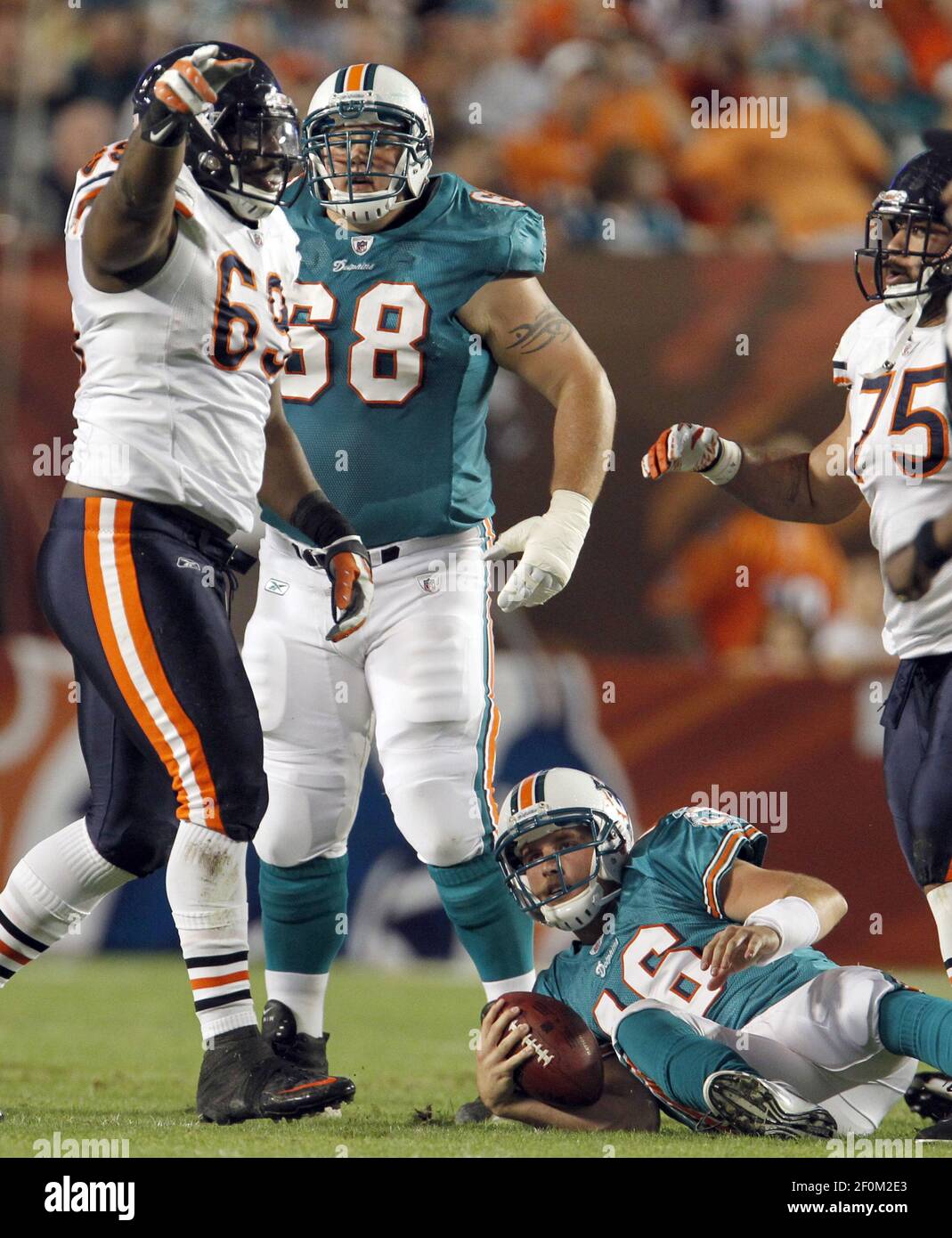 Miami Dolphins quarterback Tyler Thigpen (16) is sacked in the second ...