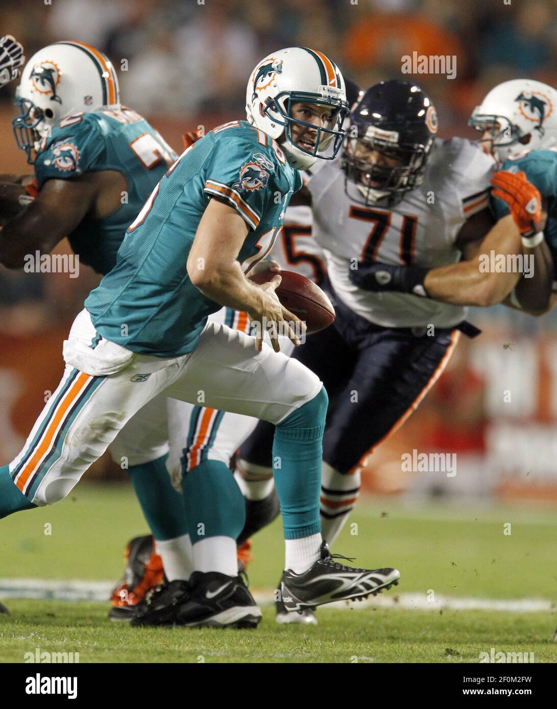 Miami Dolphins quarterback Tyler Thigpen looks to handoff to running ...