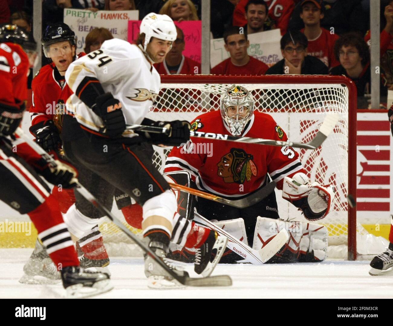 Chicago Blackhawks' Corey Crawford and Brian Campbell defend against ...