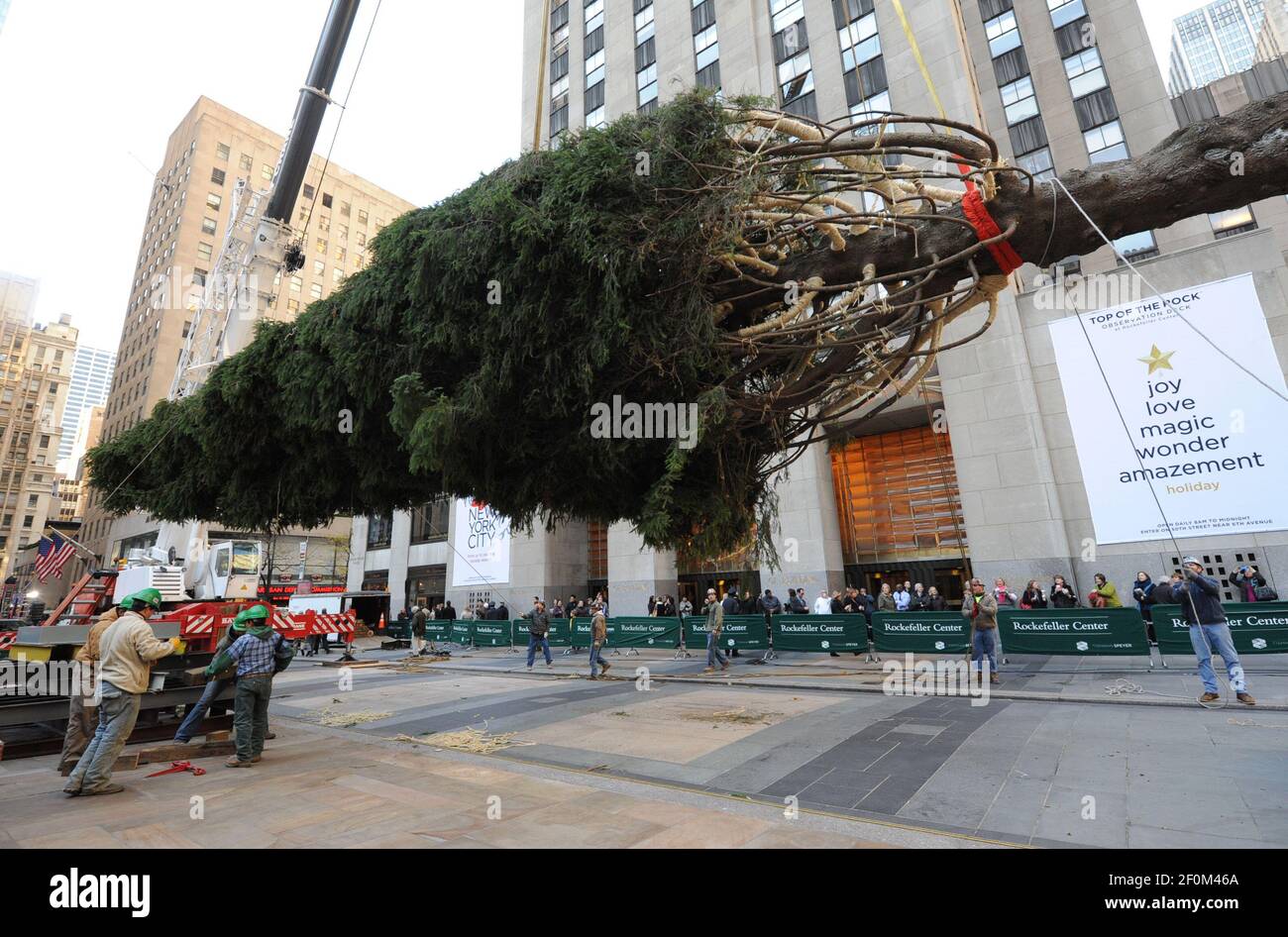 The 74-foot tall Rockefeller Center Christmas Tree is put into place at ...