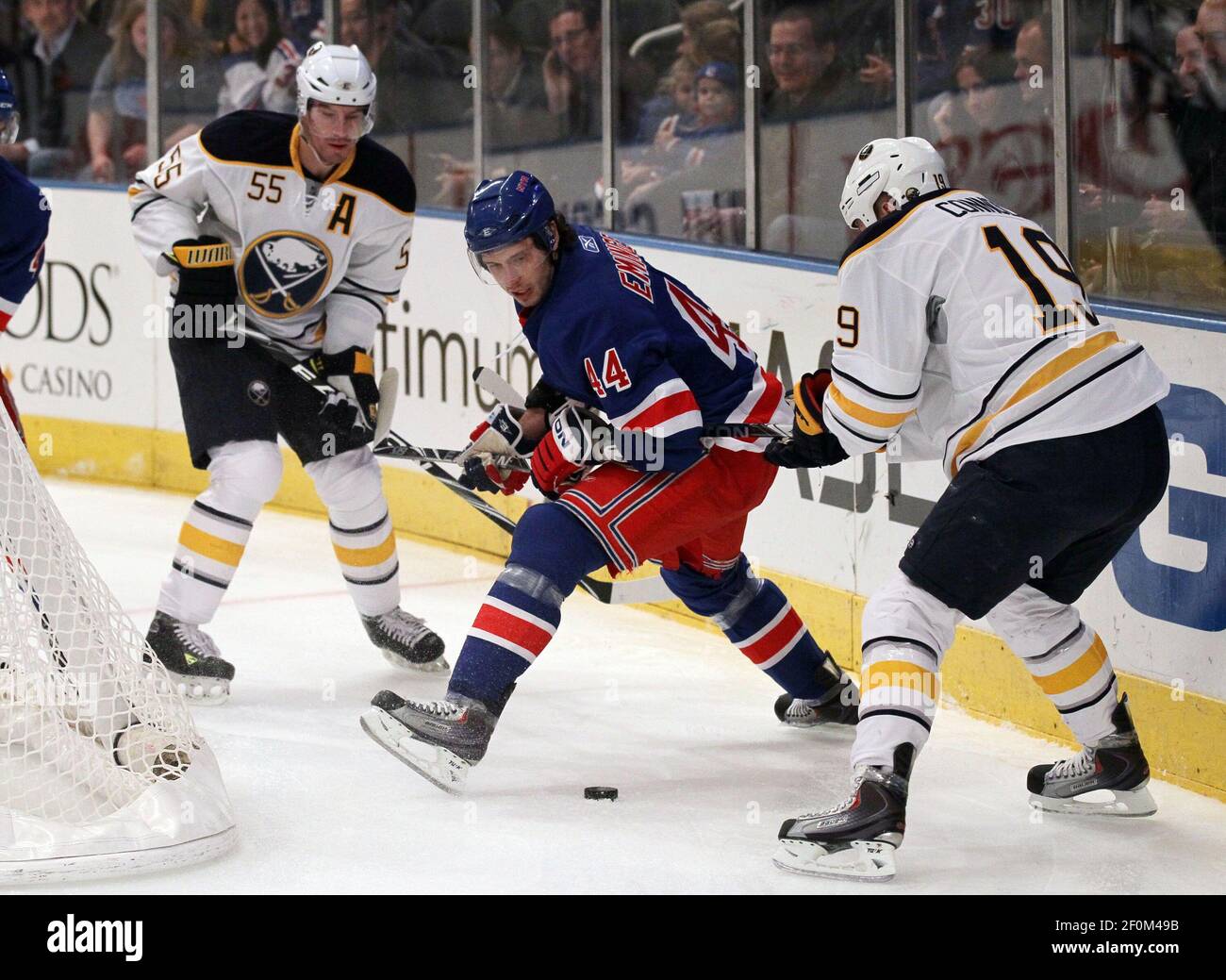 Steve Eminger (44) of the New York Rangers plays the puck against Tim ...