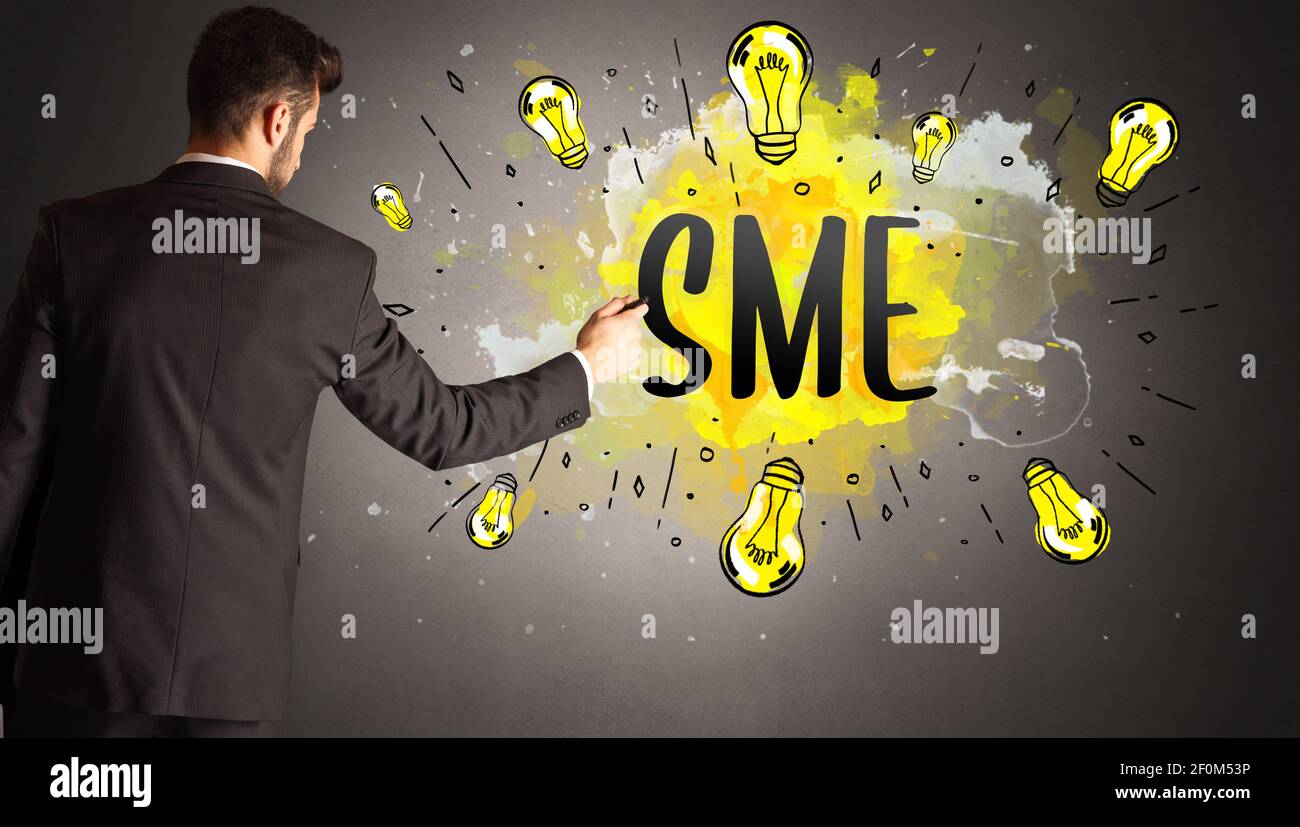 businessman drawing colorful light bulb with SME abbreviation, new ...