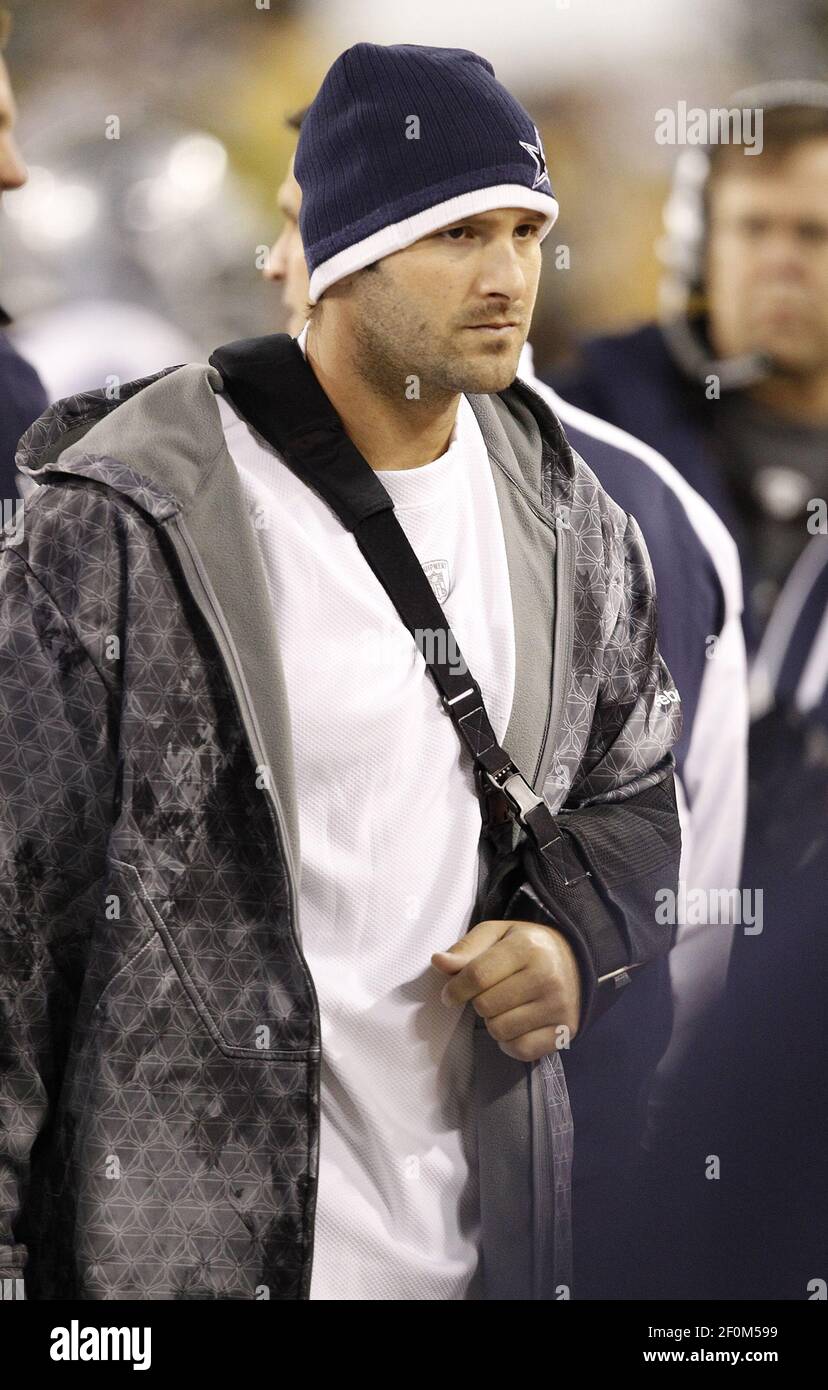 Injured Tony Romo of the Dallas Cowboys watches his team during an NFL ...
