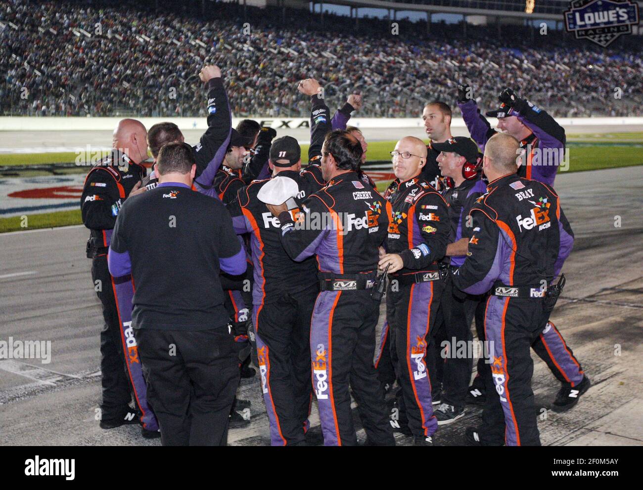 Denny Hamlin's pit crew celebrate their win at the NASCAR AAA Texas 500 ...