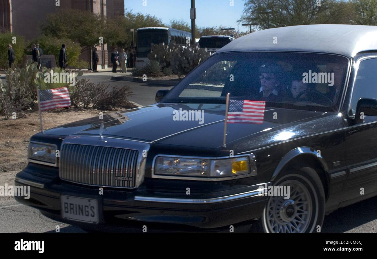 The hearse carrying the body Judge John M. Roll's coffin leaves St ...