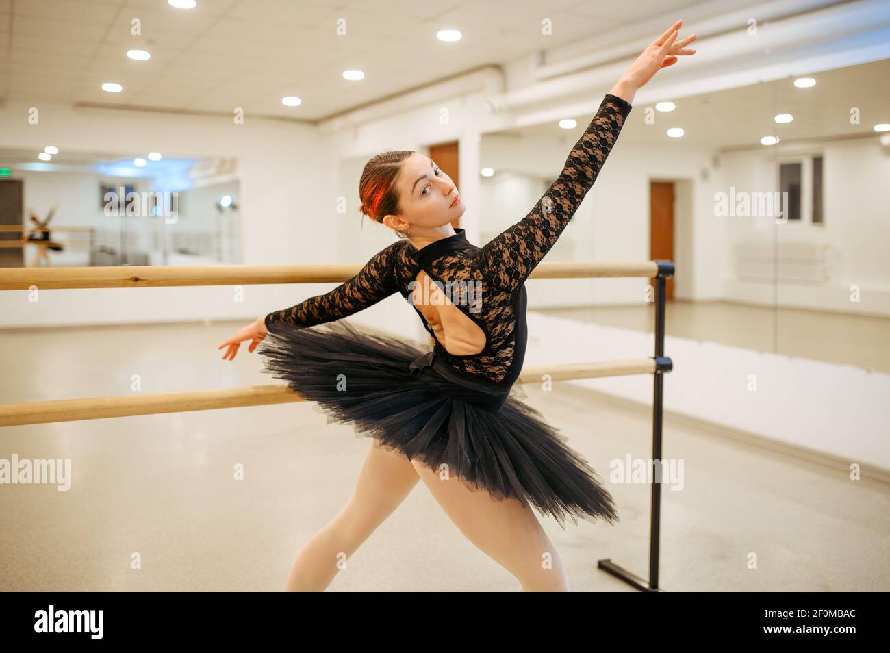 Choreographer poses at the barre, ballet school Stock Photo - Alamy