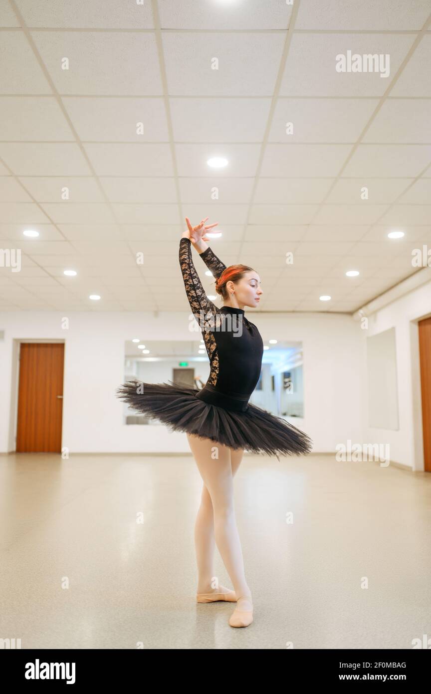 Ballerina poses at barre in class, ballet school Stock Photo - Alamy