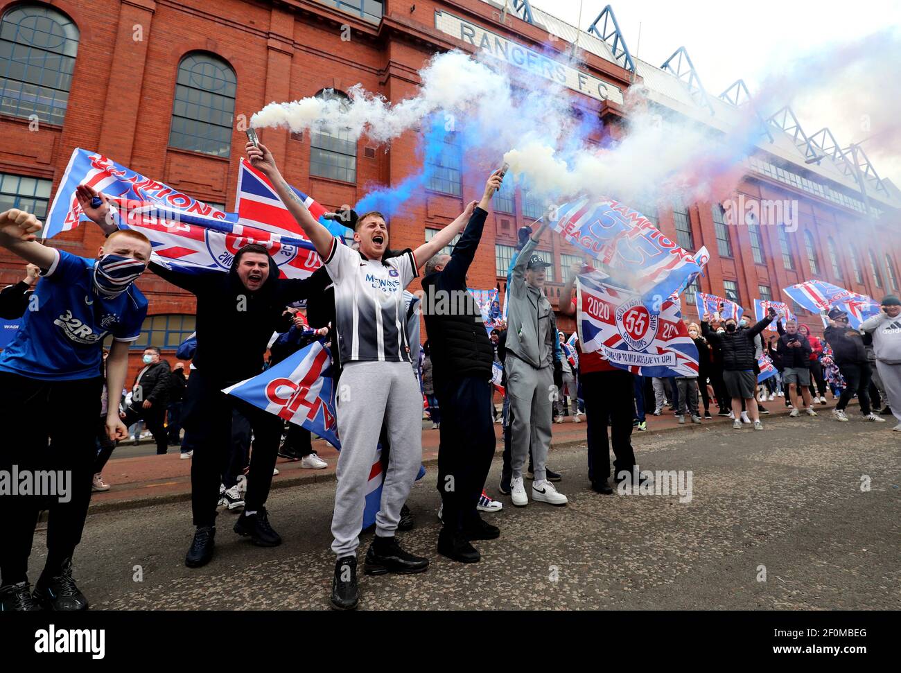 Rangers fans celebrate outside of the Ibrox Stadium after Rangers win ...