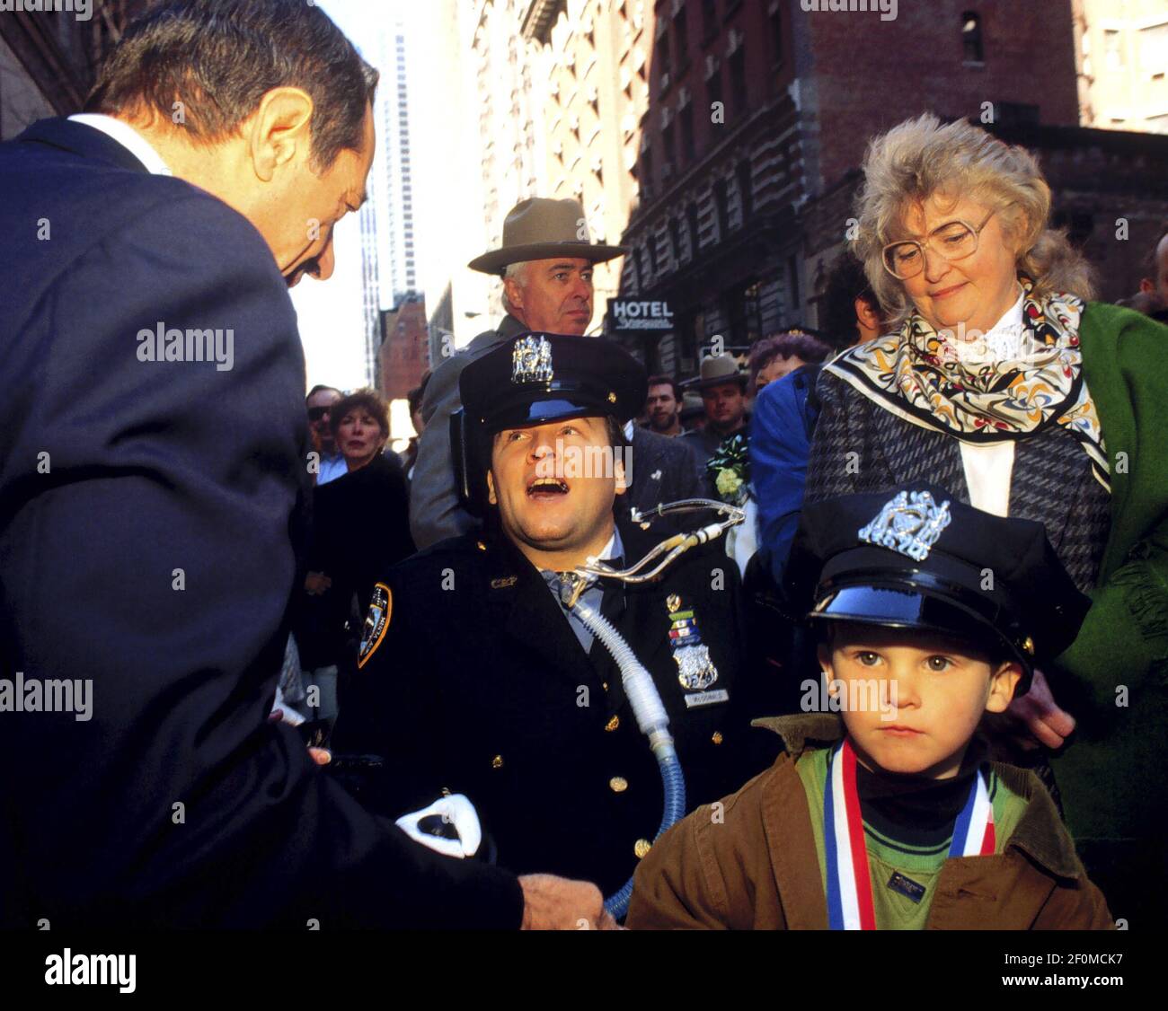 Police Officer Steven McDonald, center, is greeted by Gov. Mario Cuomo ...