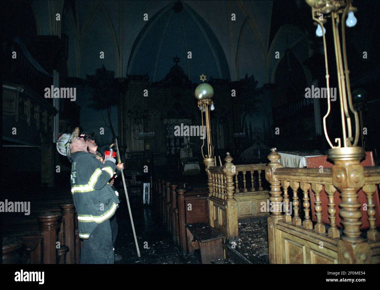 Firefighters inspect the damage of the landmark building of ...