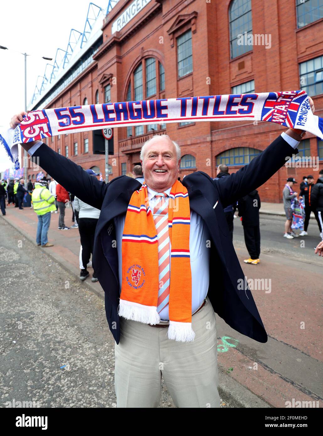 A Rangers fan celebrates outside of the Ibrox Stadium after Rangers win ...