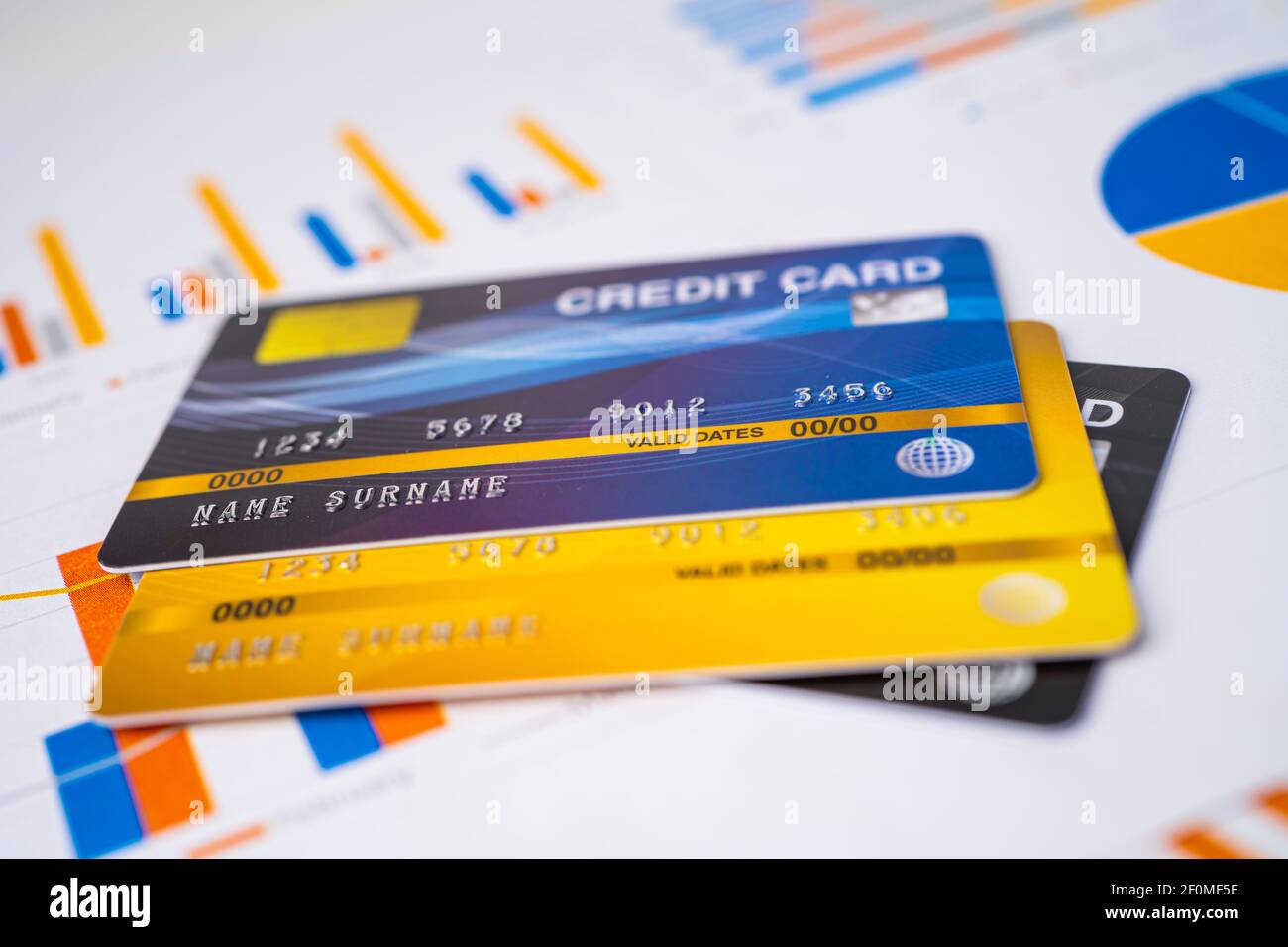 Credit card model on chart and graph spreadsheet paper. Finance ...