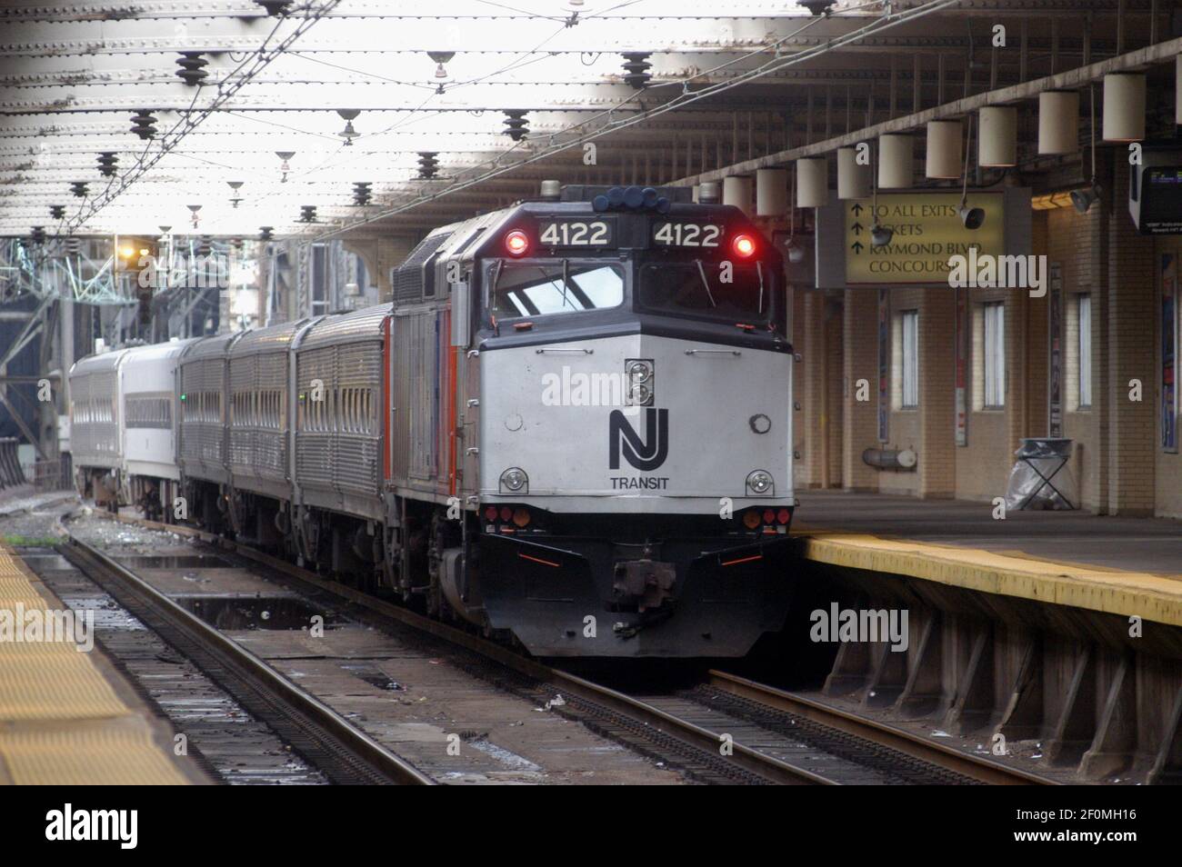 During evening rush hour, New Jersey Transit train arrives at Penn Station, Newark, New Jersey ...