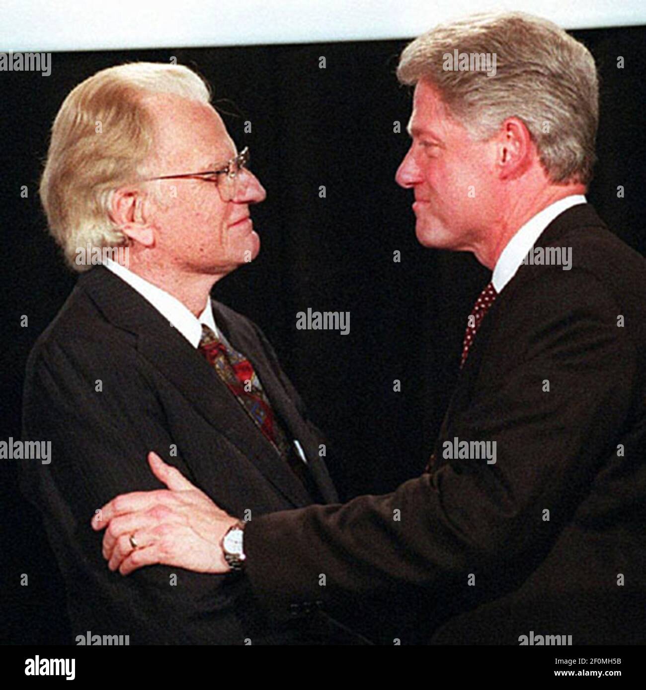 Billy Graham and President Bill Clinton talk before Graham's address on ...