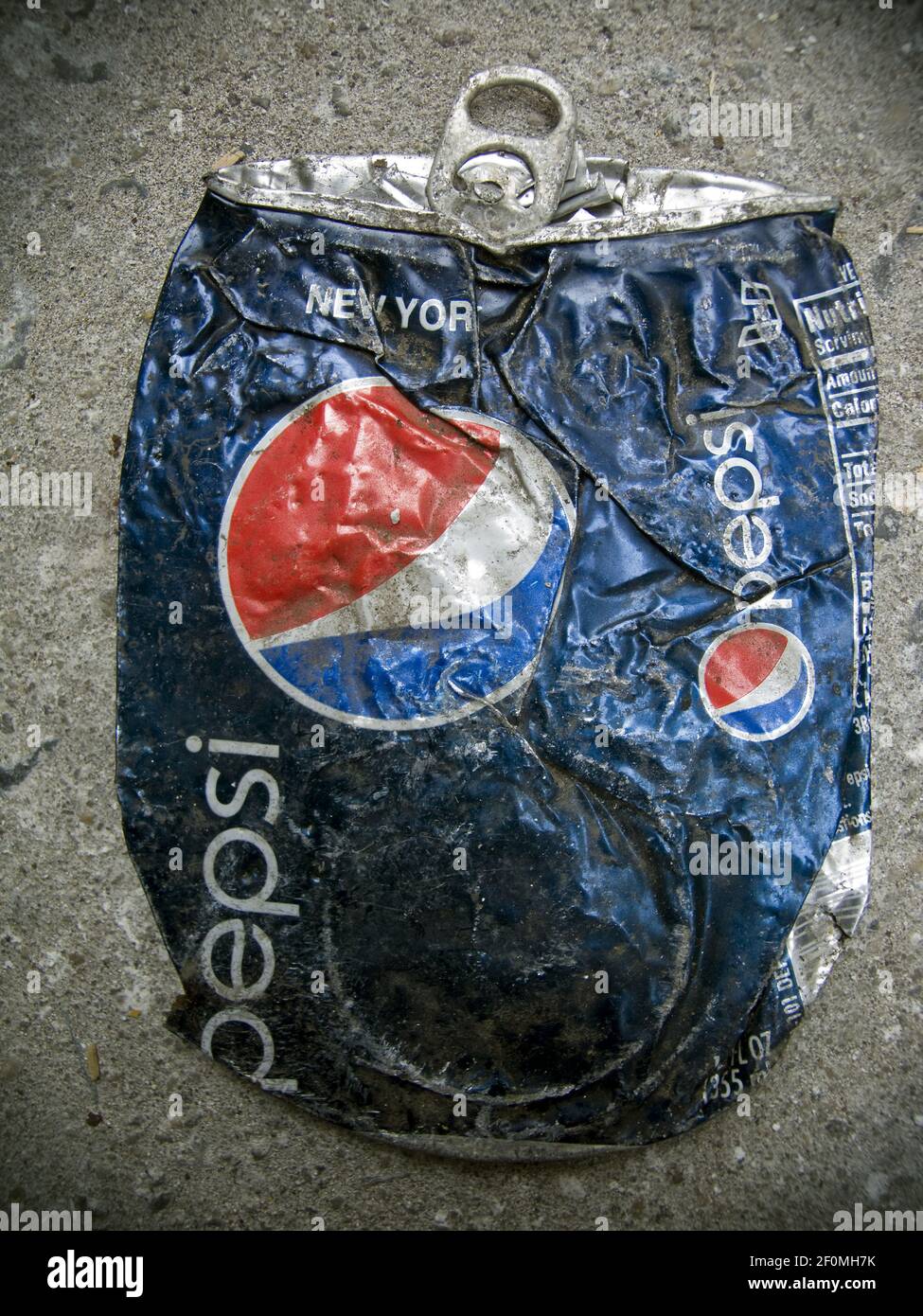 An aluminum can of Pepsi-Cola crushed by a car on Saturday, March 14 ...