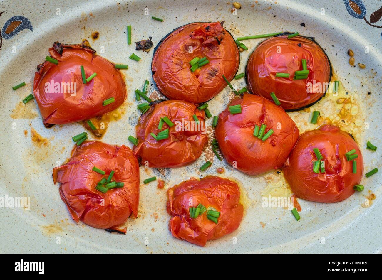 Grilled tomato halves cut Stock Photo - Alamy