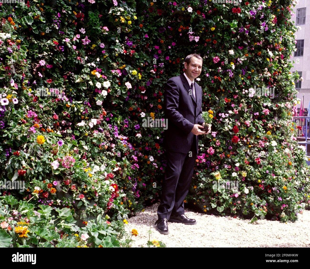 The artist Jeff Koons poses in front of his public sculpture "Puppy" on ...