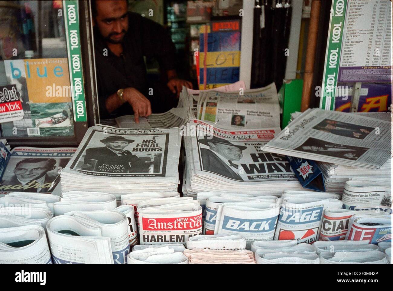 A newsstand in New York on May 15, 1998 displays newspapers with ...