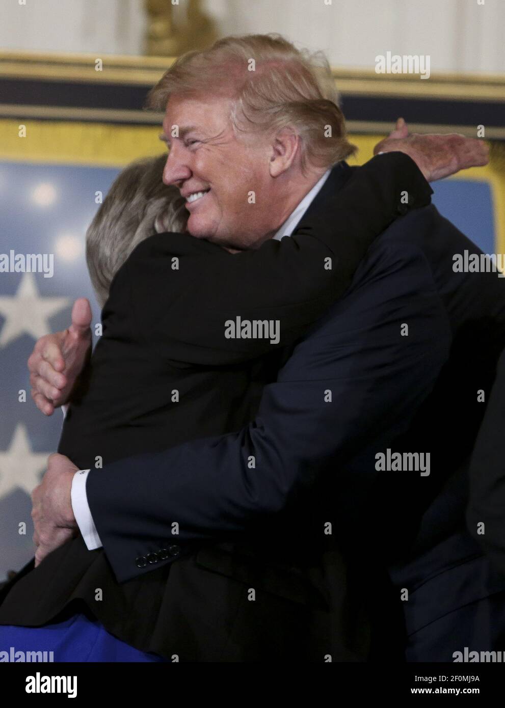 President Donald Trump hugs Pauline Connor, widow of 1st Lt. Garlin ...