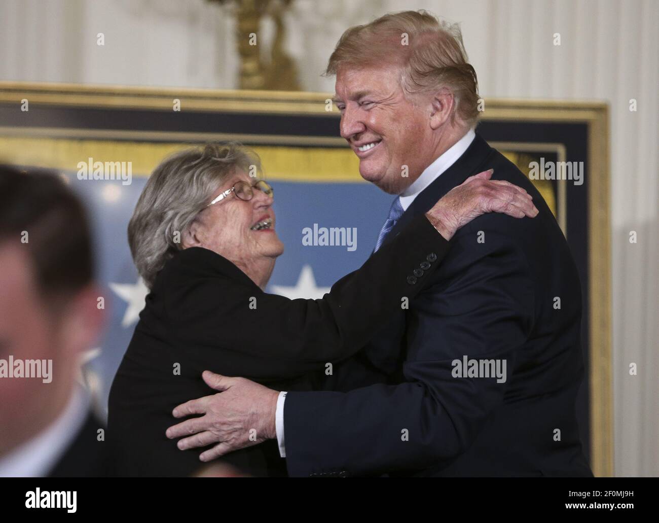 President Donald Trump hugs Pauline Connor, widow of 1st Lt. Garlin ...