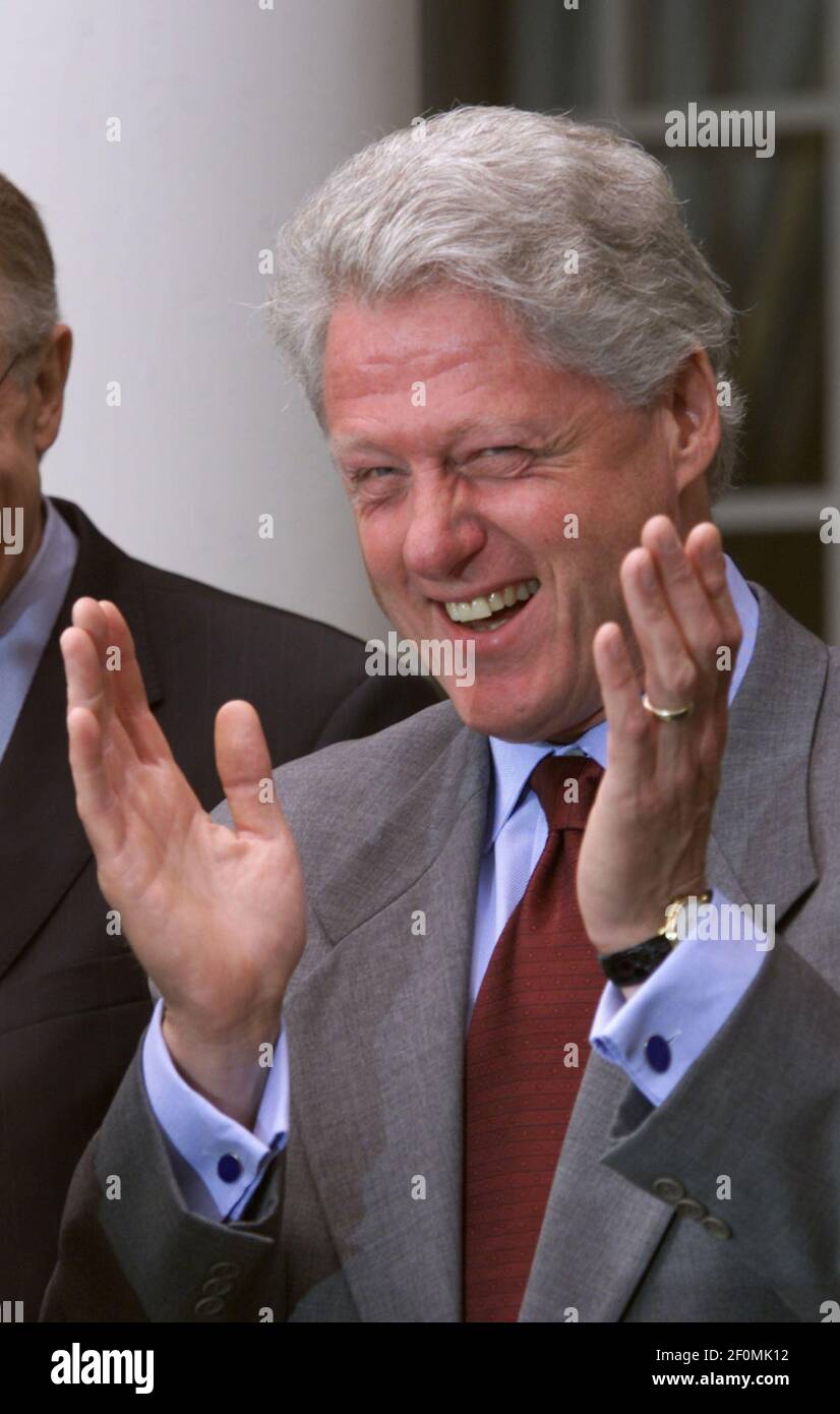 President Bill Clinton laughs during a Rose Garden ceremony with ...
