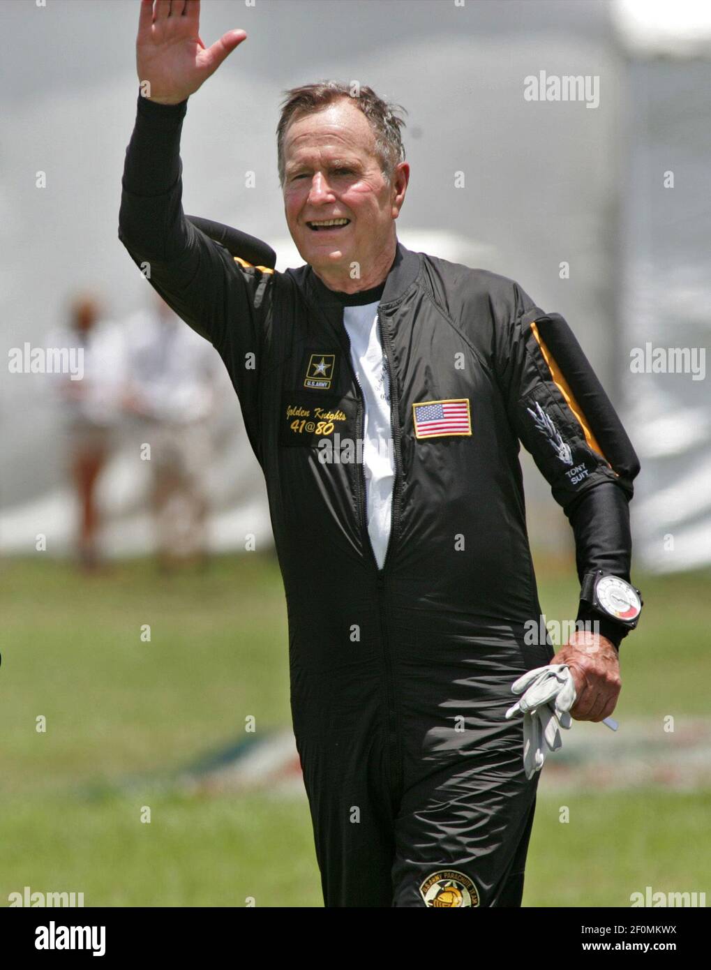 Former President George H. W. Bush greets the crowd after competing his ...