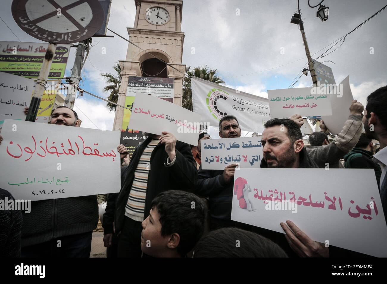 Activists are seen holding placards during the protest. The people and ...