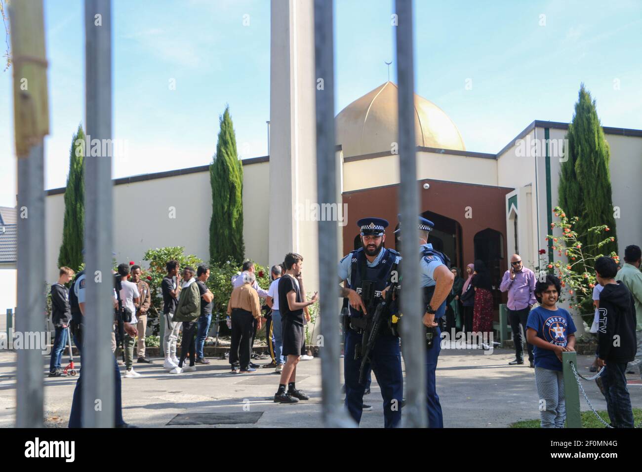 Police stand guard inside the Al Noor Mosque where 43 worshipers were ...
