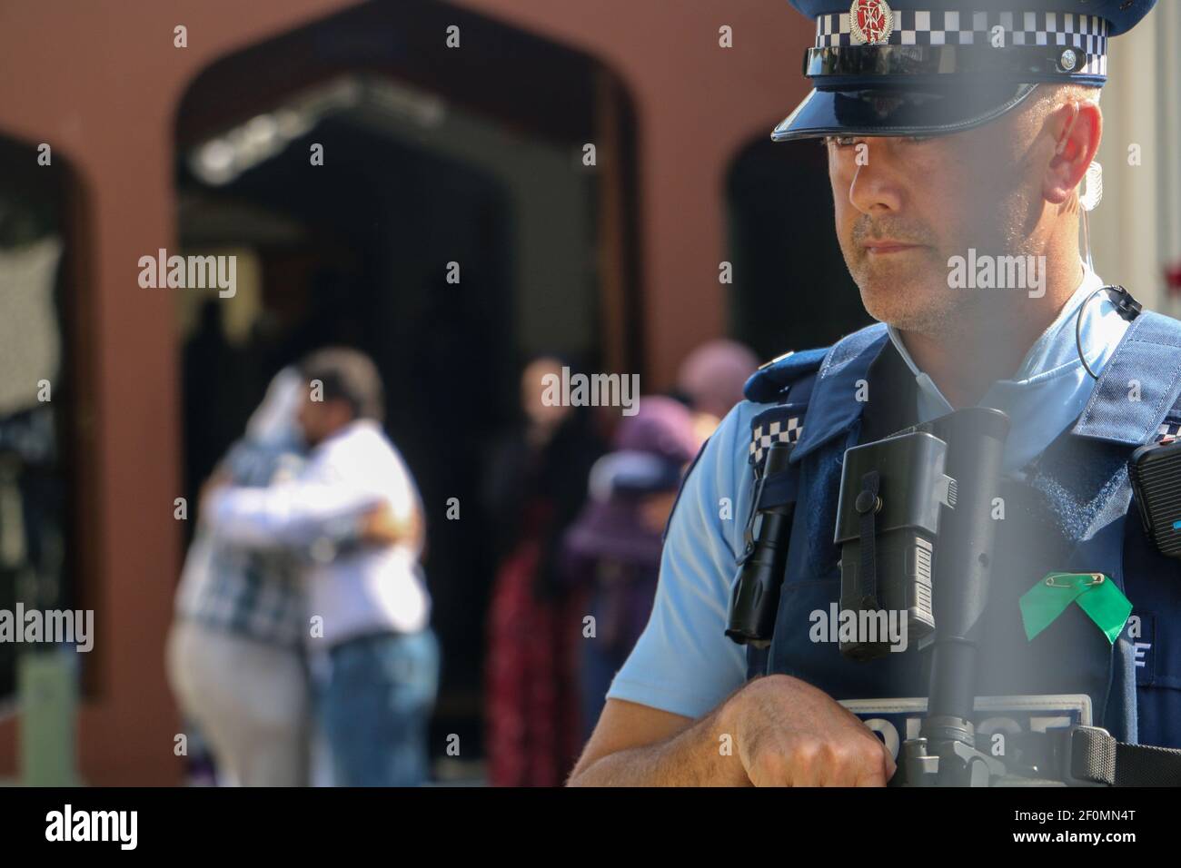 Members of the Islamic community embrace at the doors of the Al Noor ...
